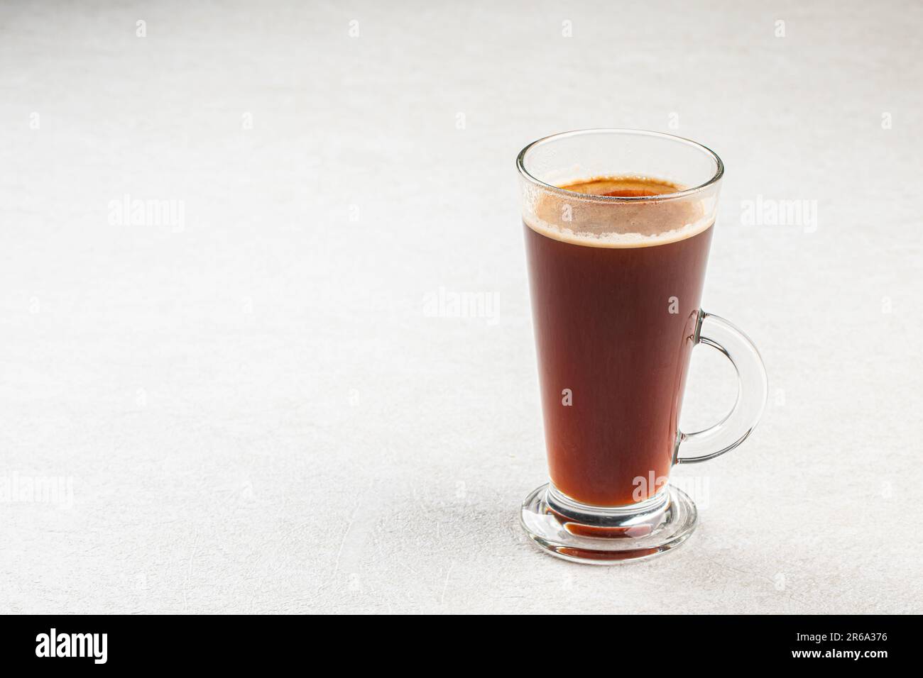 Glass mug of hot americano coffee Stock Photo - Alamy