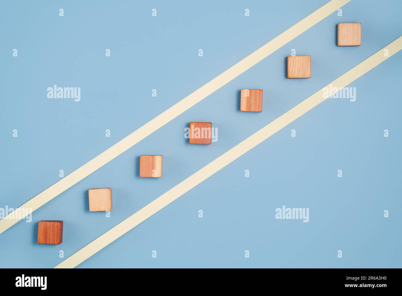 blank wooden cubes in a diagonal line shades ranging from dark to light ...