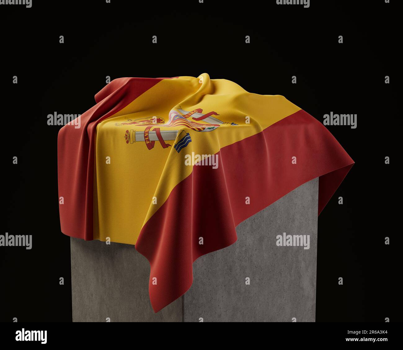 A spain flag draped over a stone plinth on an isolated dark studio ...