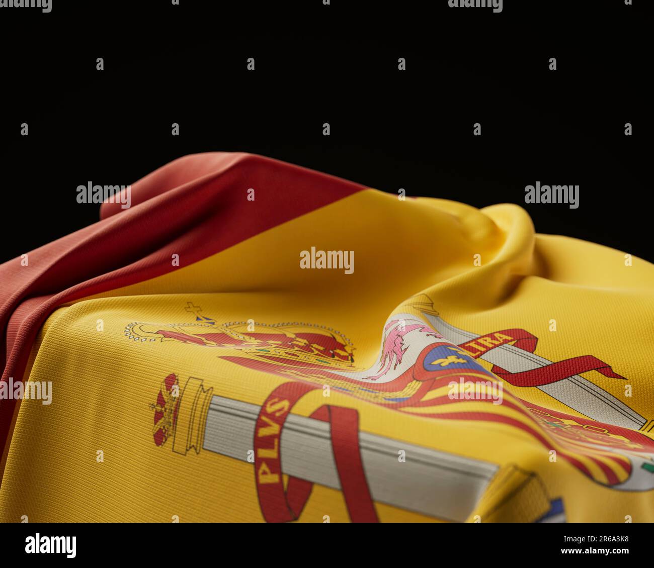 A spain flag draped over a stone plinth on an isolated dark studio ...