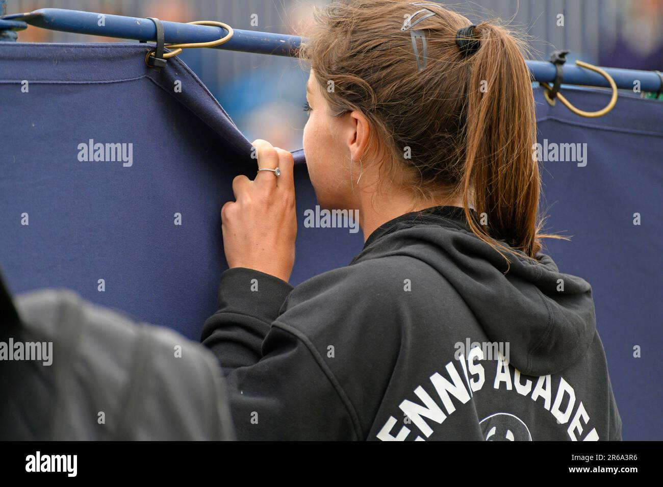 British No 2 Jodie Burrage sneeks a look over the Centre Court curtains ...