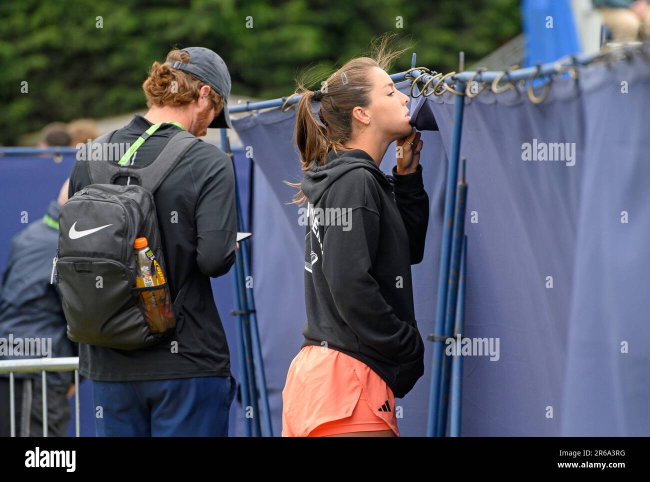 British No 2 Jodie Burrage sneeks a look over the Centre Court curtains ...