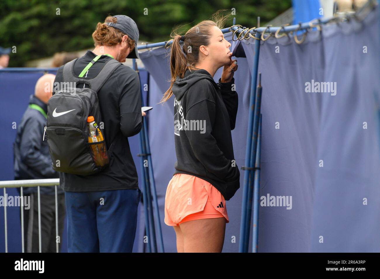 British No 2 Jodie Burrage sneeks a look over the Centre Court curtains ...