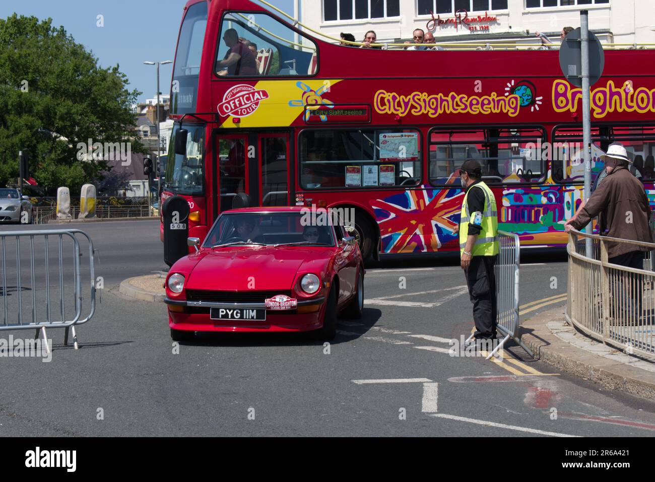 Datsun 240Z PYG 11M with a City of Brighton Sightseeing bus at the ...