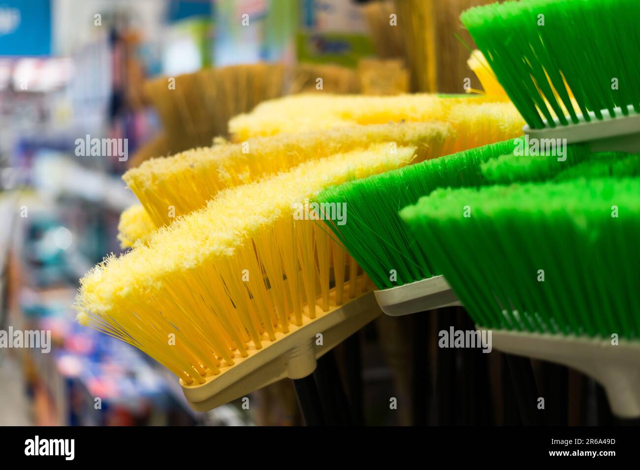 Plastic brushes for cleaning premises. Assortment of multi-colored ...
