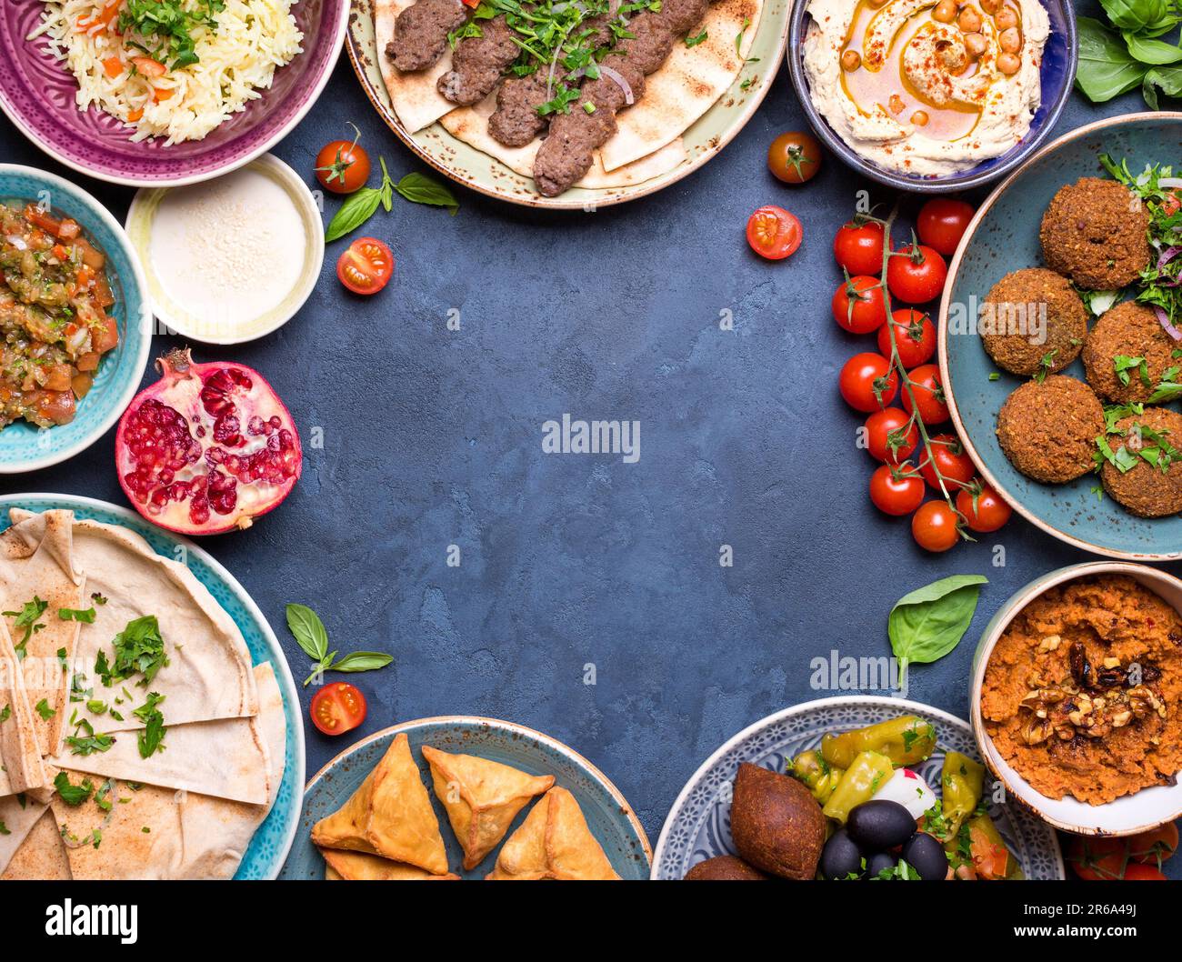 Middle eastern or arabic dishes and assorted meze on concrete rustic ...