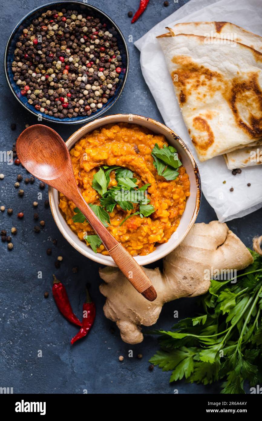 Traditional Indian lentils Dal, naan butter bread, fresh coriander ...