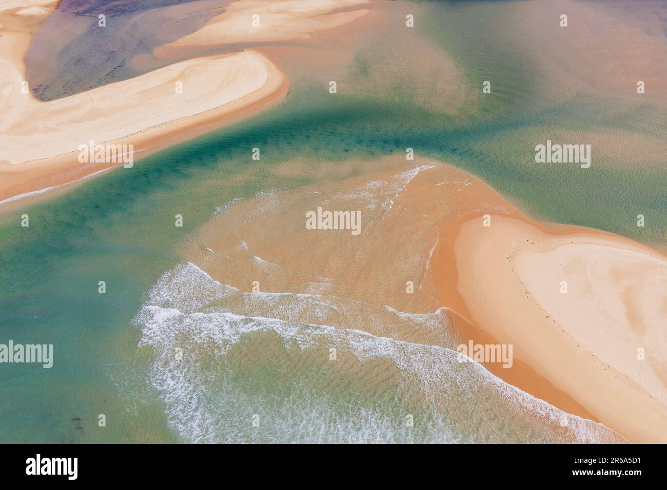 Aerial view of sandy beaches and tidal water patterns at Lake Tyers in ...