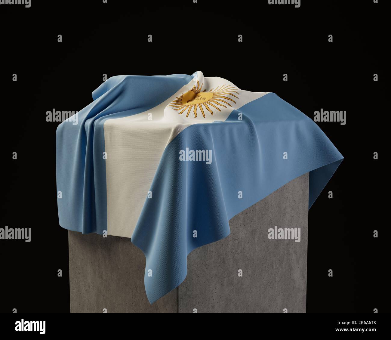 A argentina flag draped over a stone plinth on an isolated dark studio ...