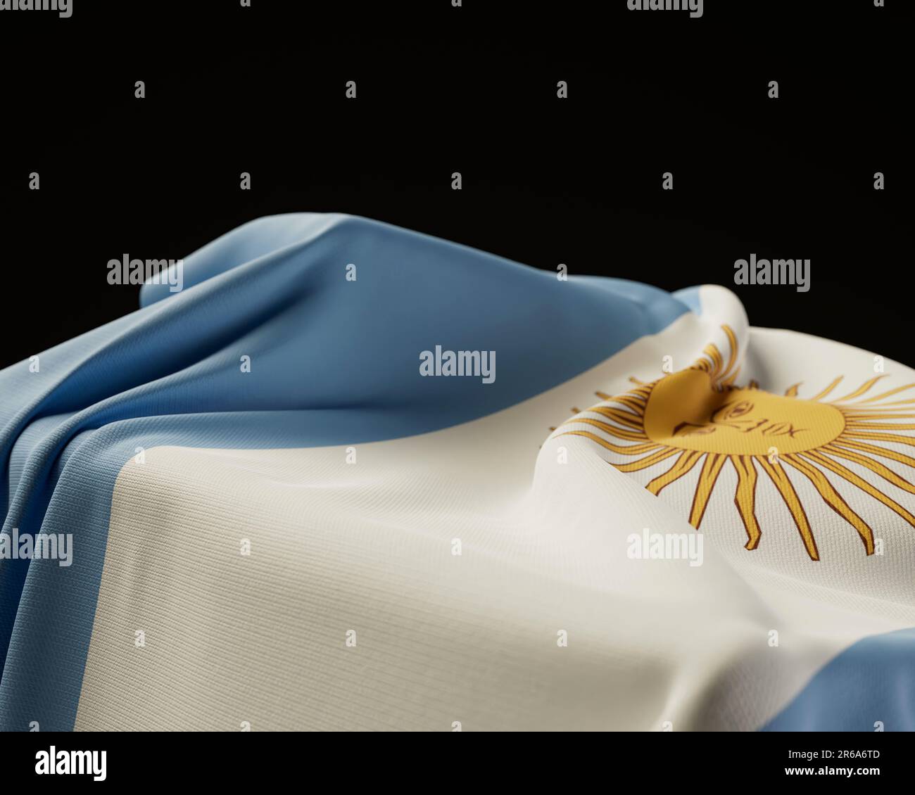 A argentina flag draped over a stone plinth on an isolated dark studio ...