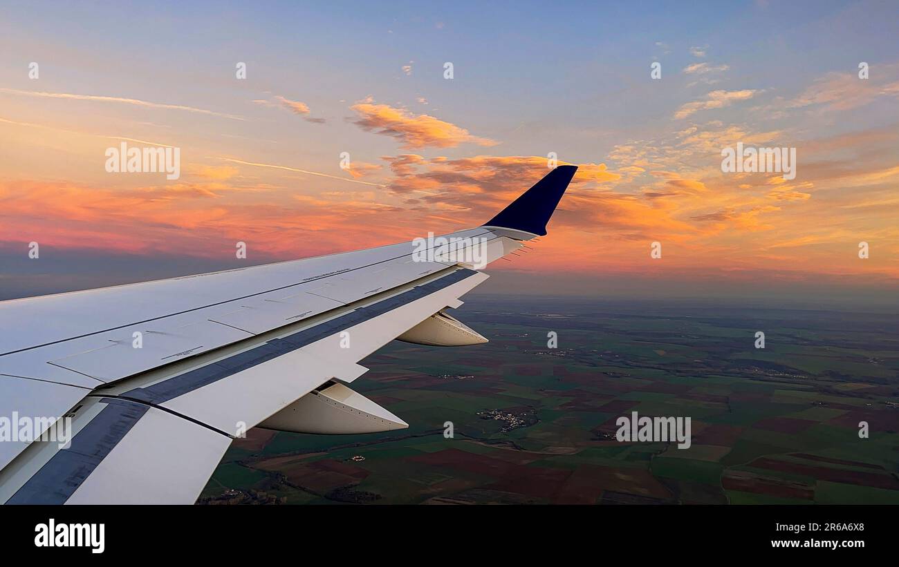 Wing of an aircraft extending the flaps and performing the approach of ...