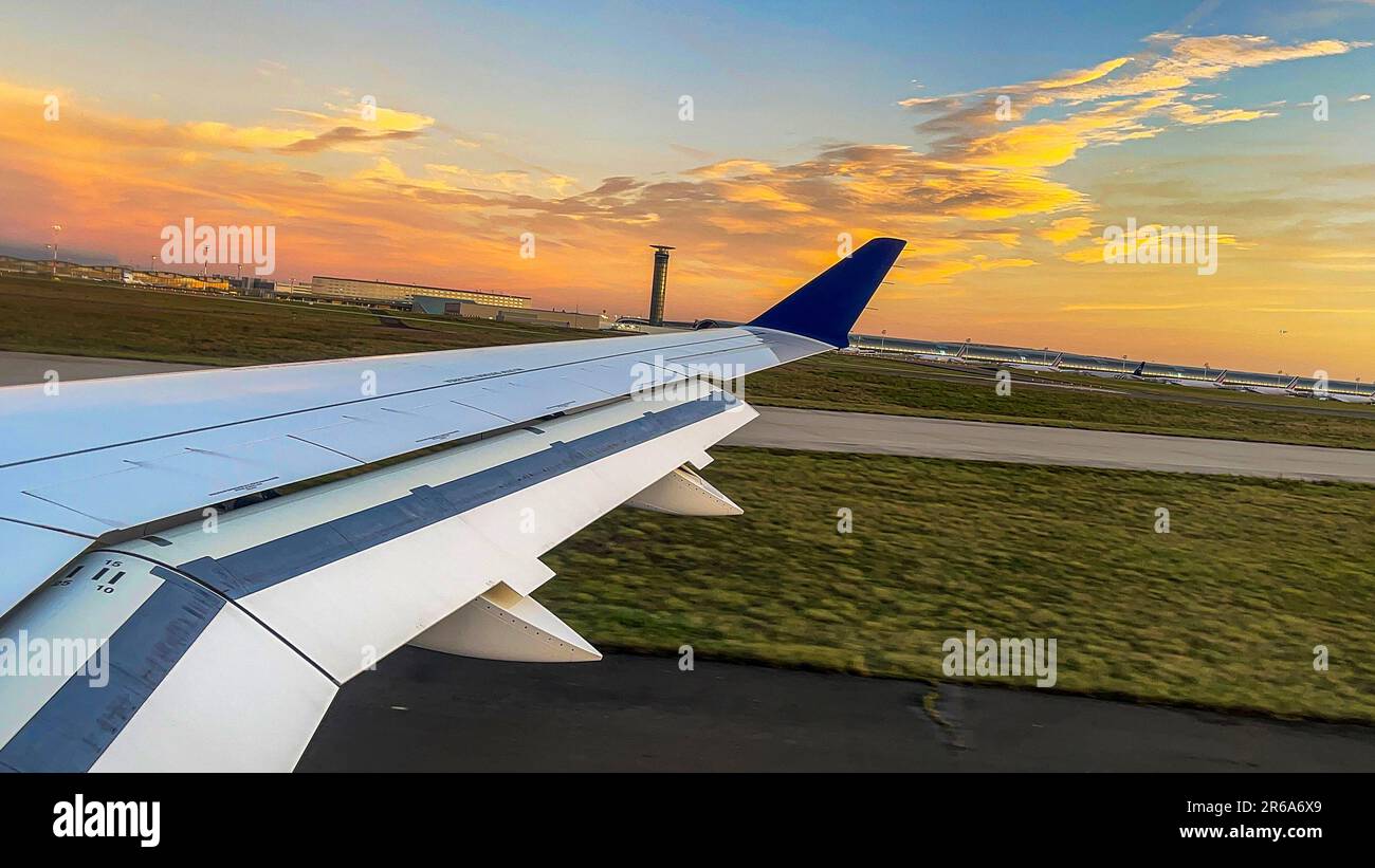 Wing of an aircraft retracting the aircraft flaps after landing at ...