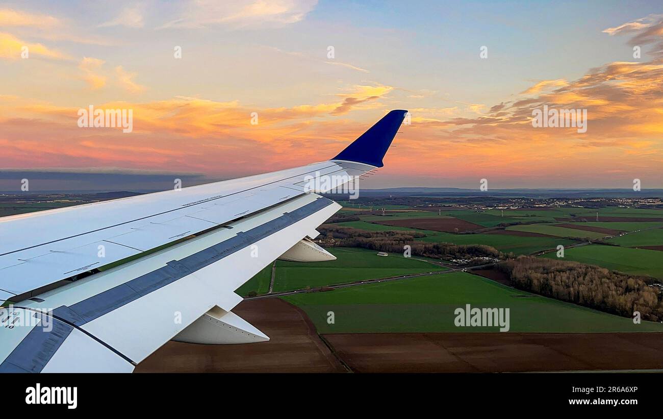 Wing of an aircraft with flaps extended and performing the approach of ...
