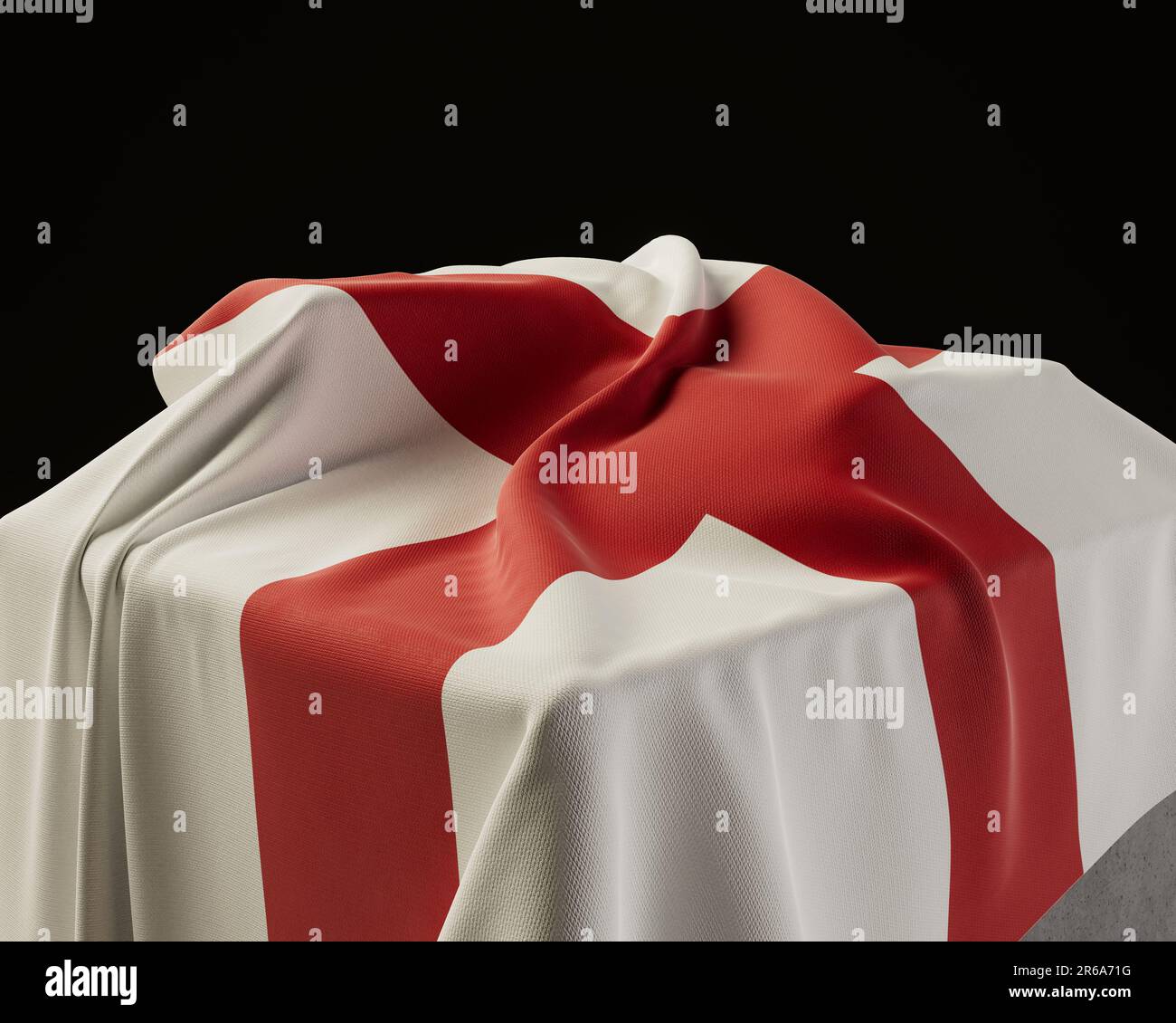 A england flag draped over a stone plinth on an isolated dark studio ...