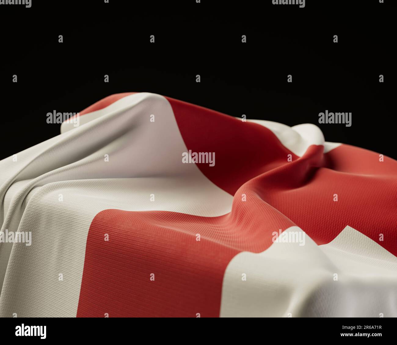 A england flag draped over a stone plinth on an isolated dark studio ...