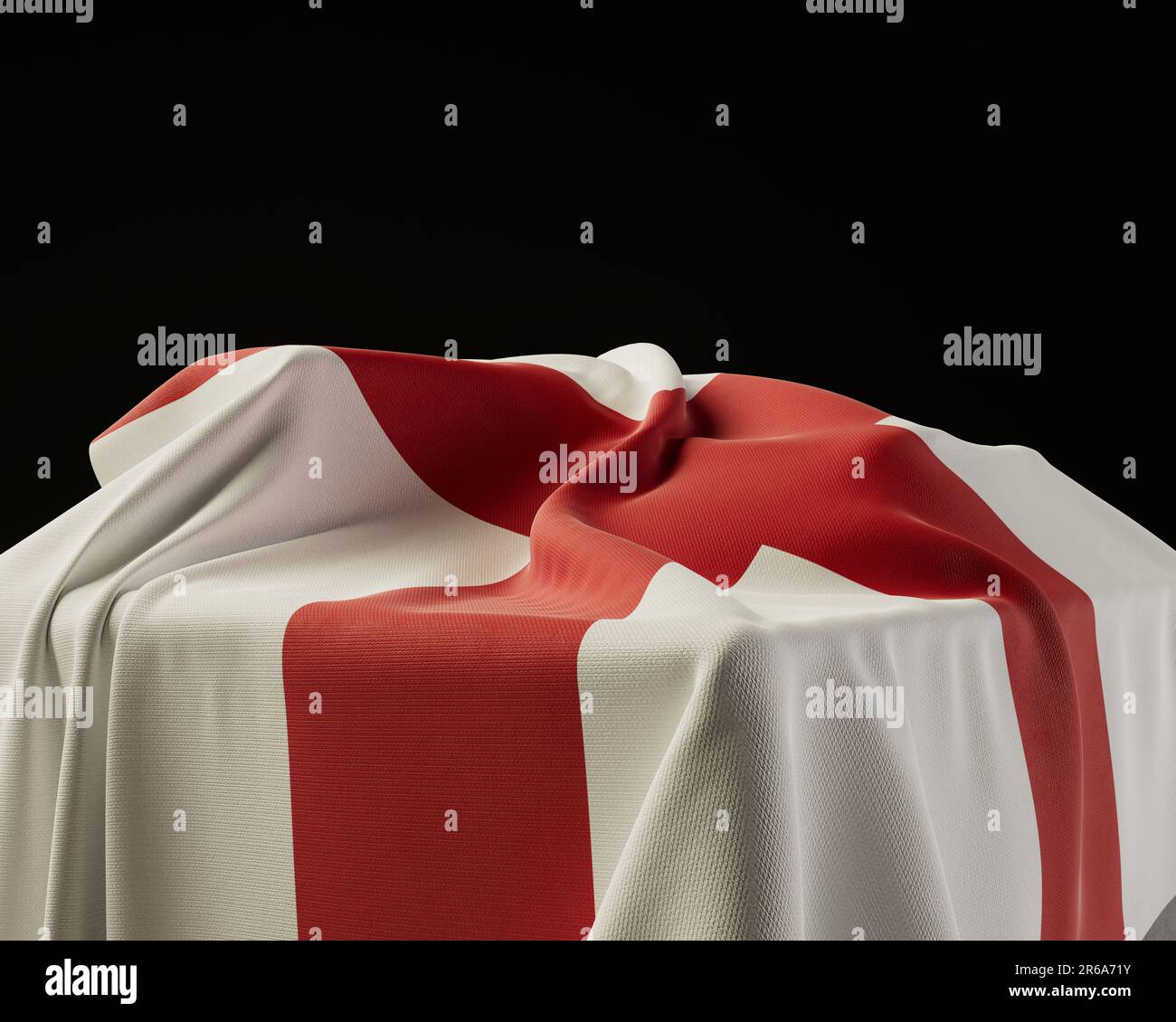 A england flag draped over a stone plinth on an isolated dark studio ...
