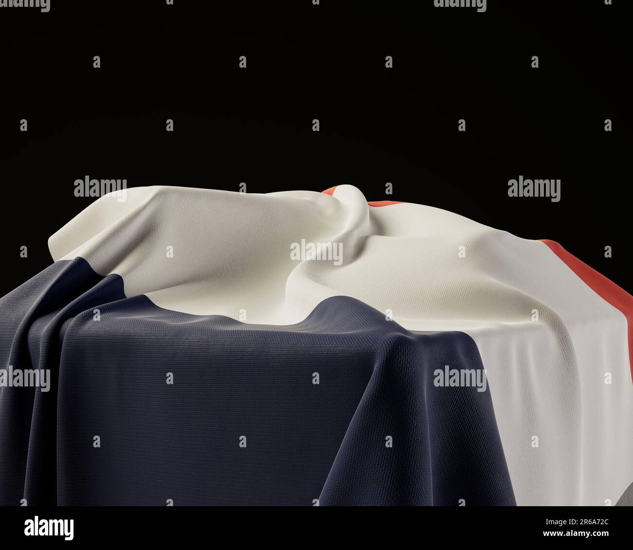 A france flag draped over a stone plinth on an isolated dark studio ...