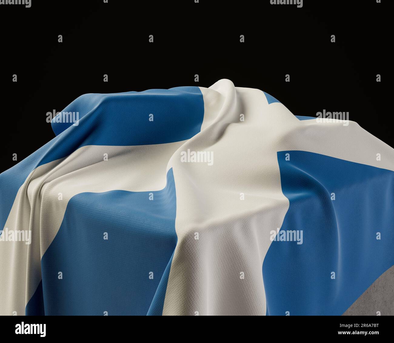 A scotland flag draped over a stone plinth on an isolated dark studio ...