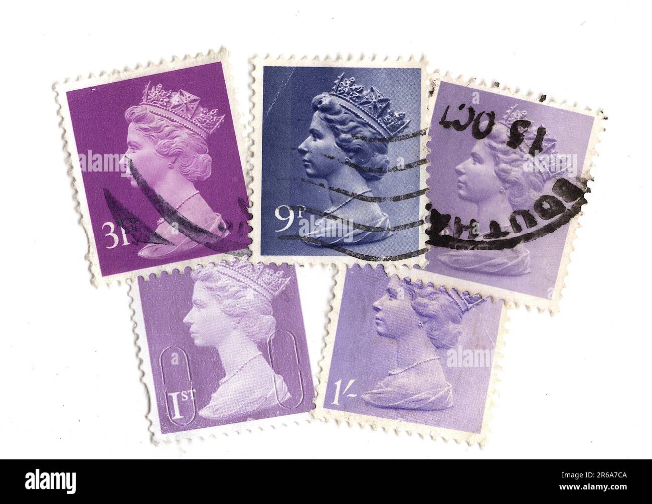 A montage of purple vintage postage stamps from the United Kingdom ...