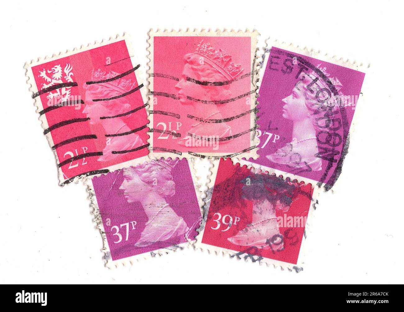 A montage of pink vintage postage stamps from the United Kingdom ...