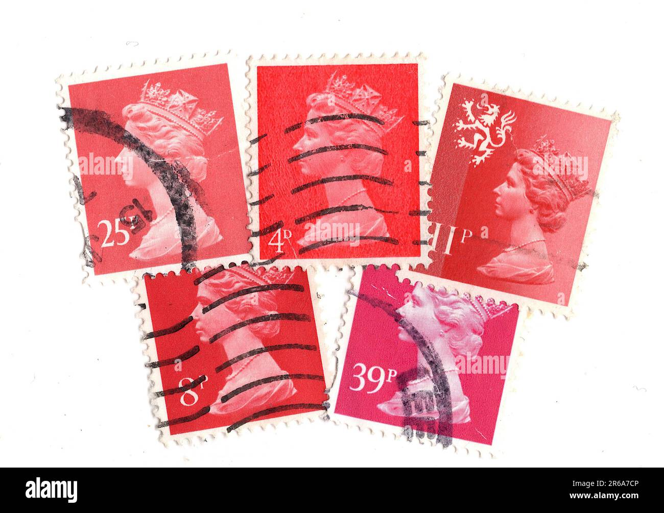 A montage of red vintage postage stamps from the United Kingdom ...