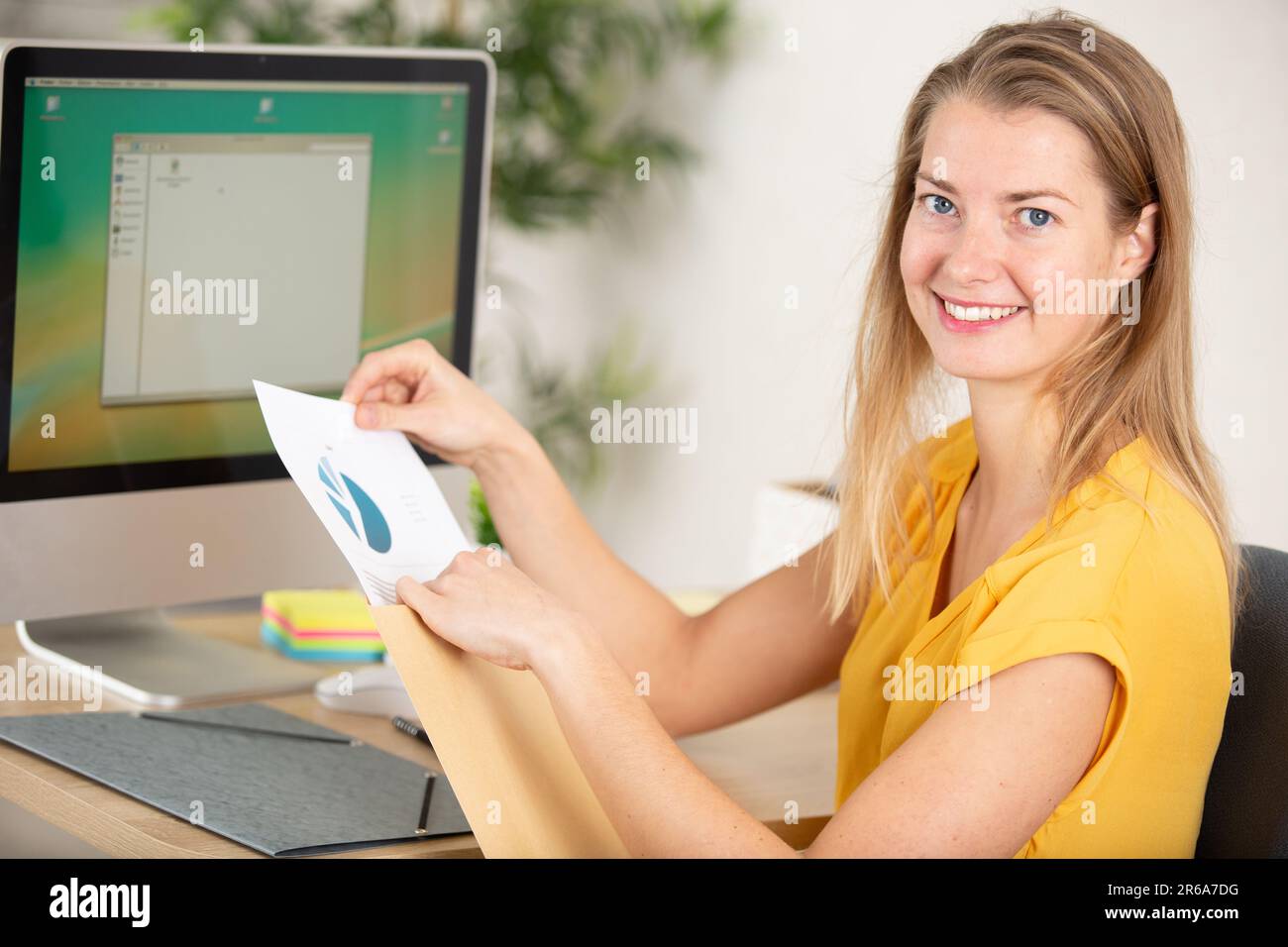 happy graphic designer in the office Stock Photo - Alamy