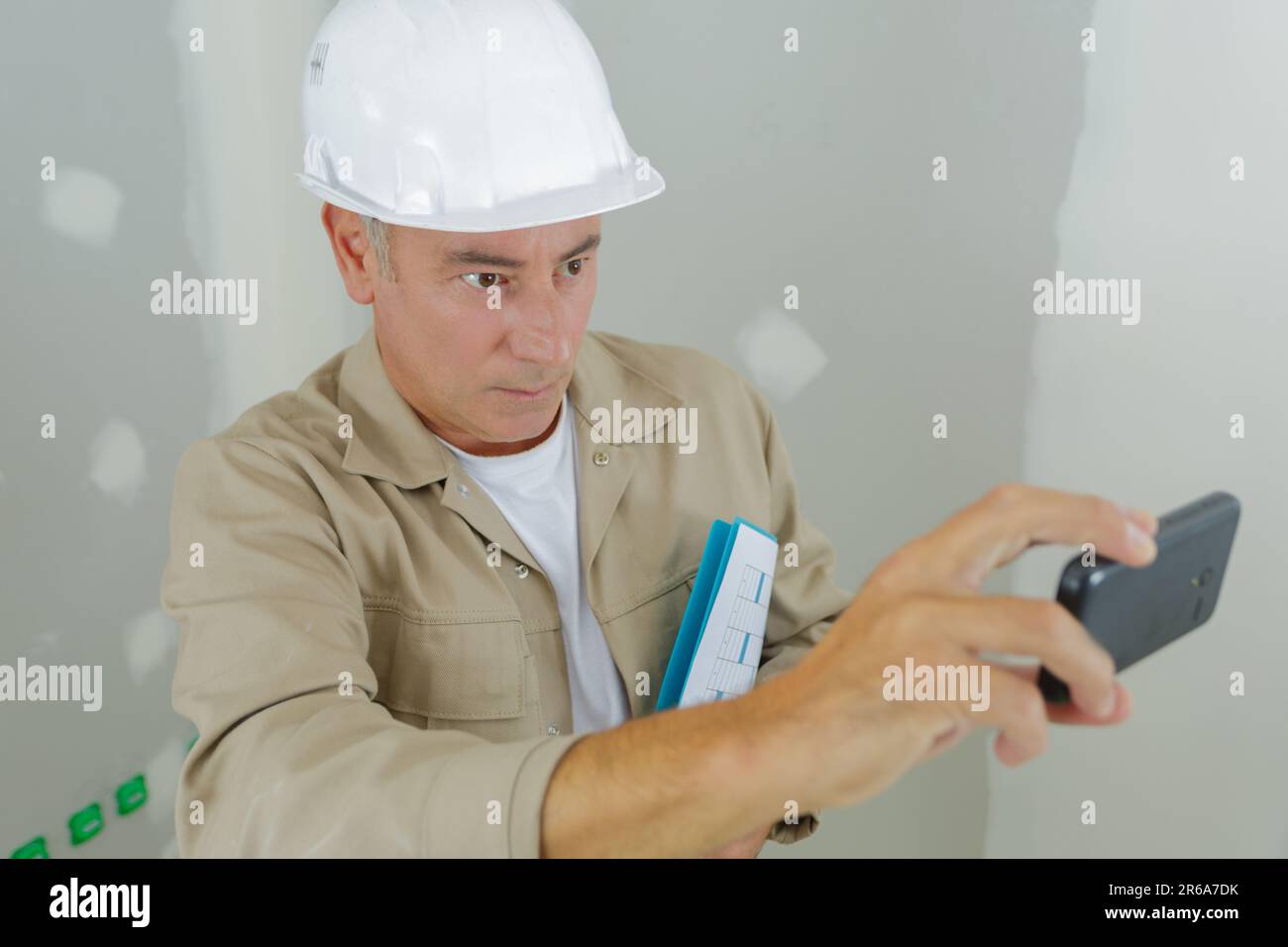 engineer taking photo of building Stock Photo - Alamy
