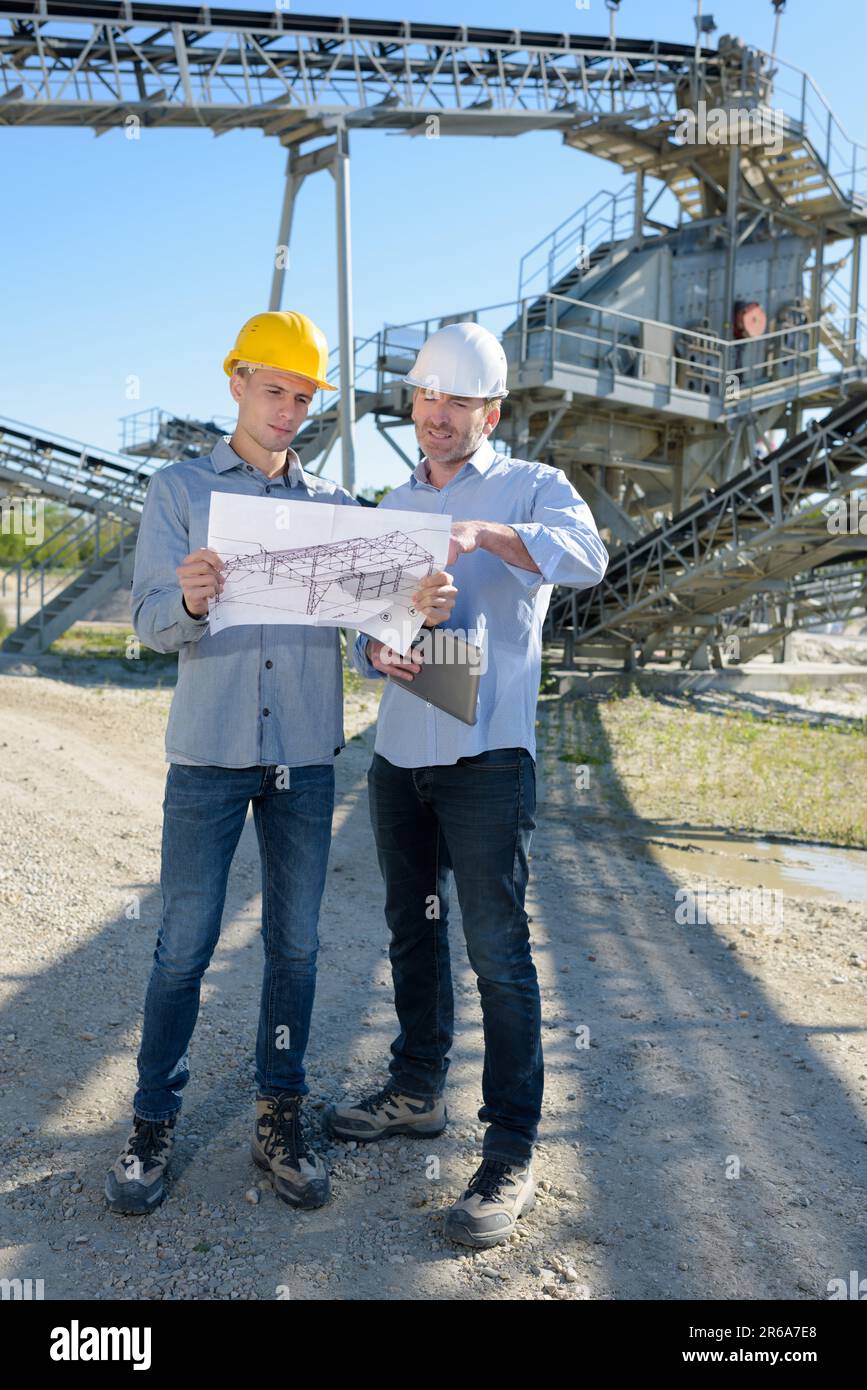 quarry and mining engineers studying the design Stock Photo - Alamy