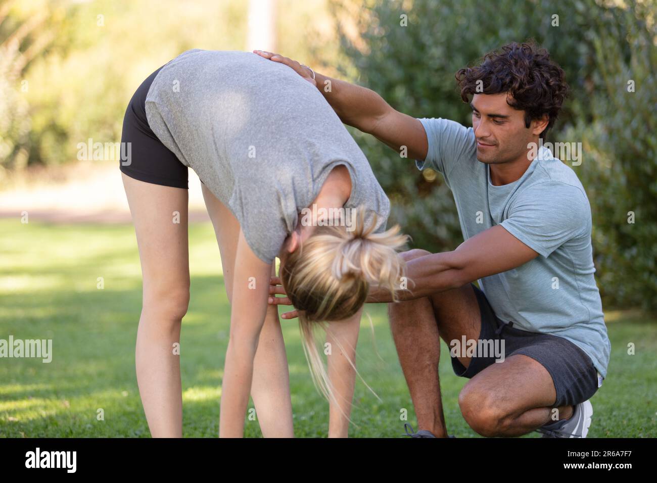 Male coach helping young hi-res stock photography and images - Alamy