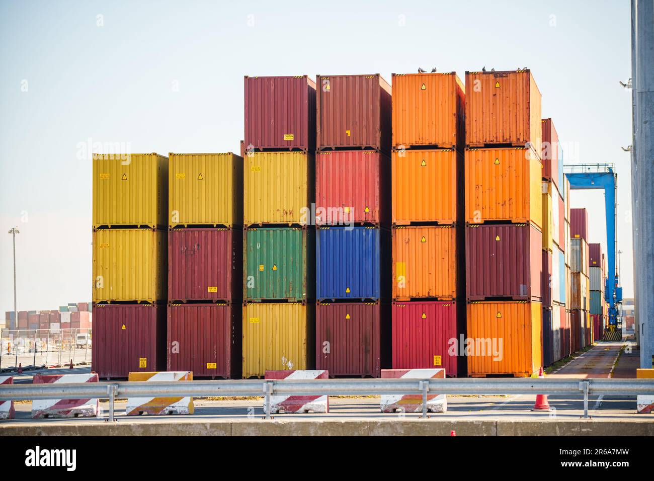Shipping containers stacked at a commercial port Stock Photo - Alamy