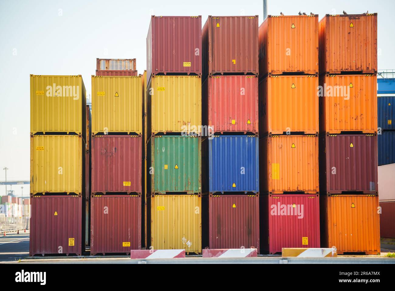 Shipping containers stacked at a commercial port Stock Photo - Alamy