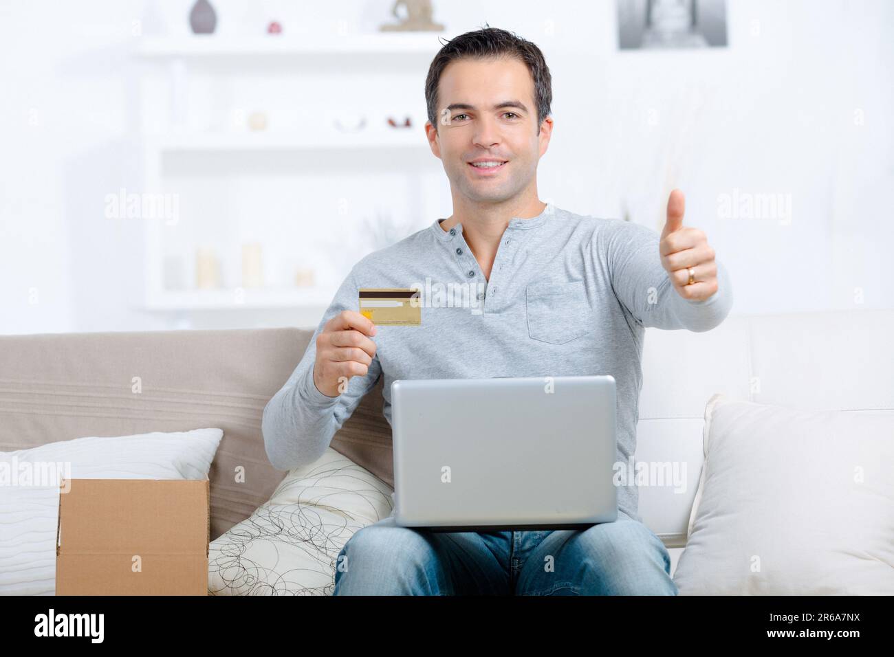 a satisfied customer shows thumb up Stock Photo - Alamy