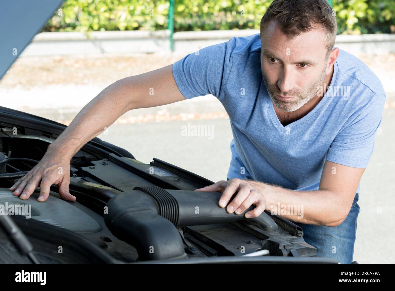 Auto mechanic installing part car hi-res stock photography and images ...
