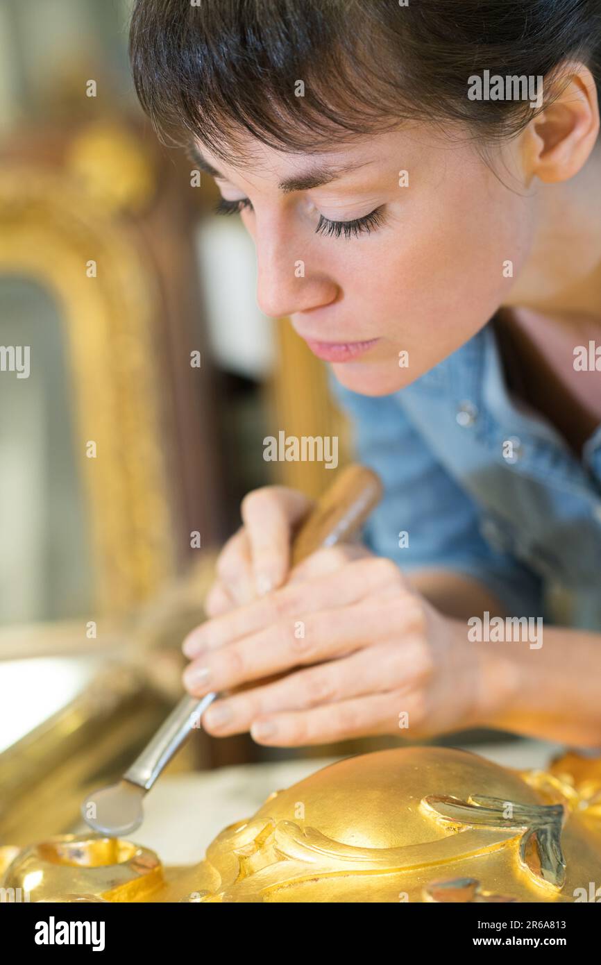 woman restoring an antique frame Stock Photo - Alamy