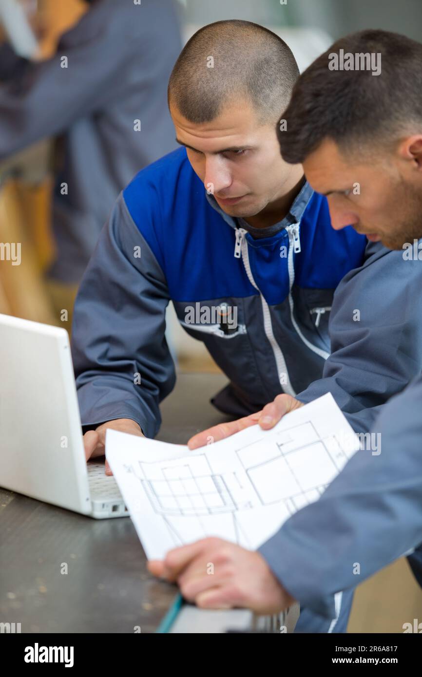 Men working in layout hi-res stock photography and images - Alamy