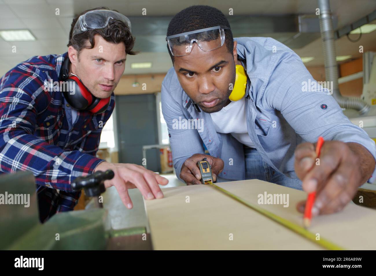carpenters marking wood in their workshop Stock Photo - Alamy