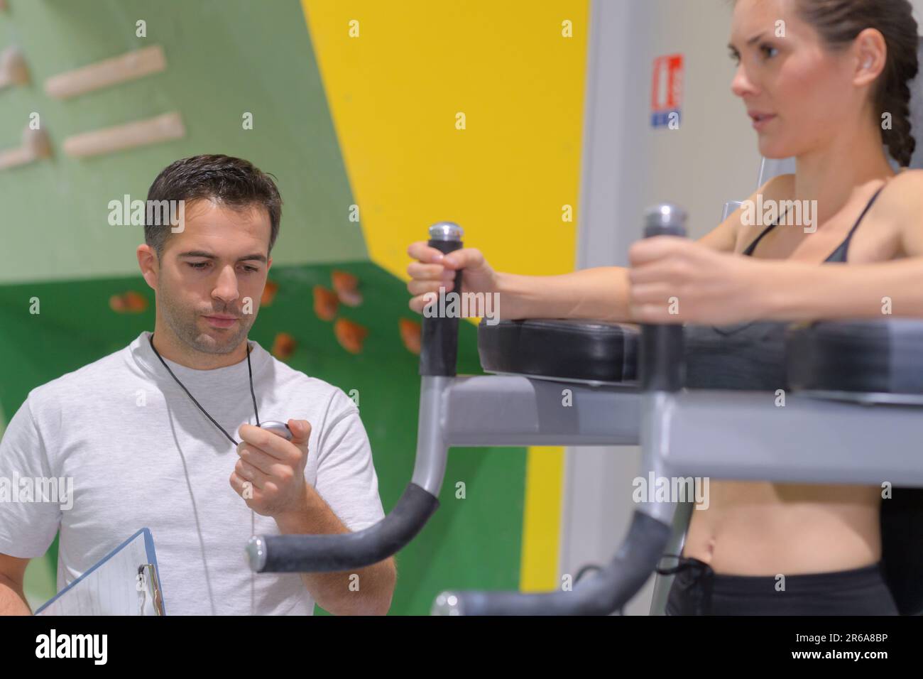 trainer timing the trainee in the gym Stock Photo - Alamy
