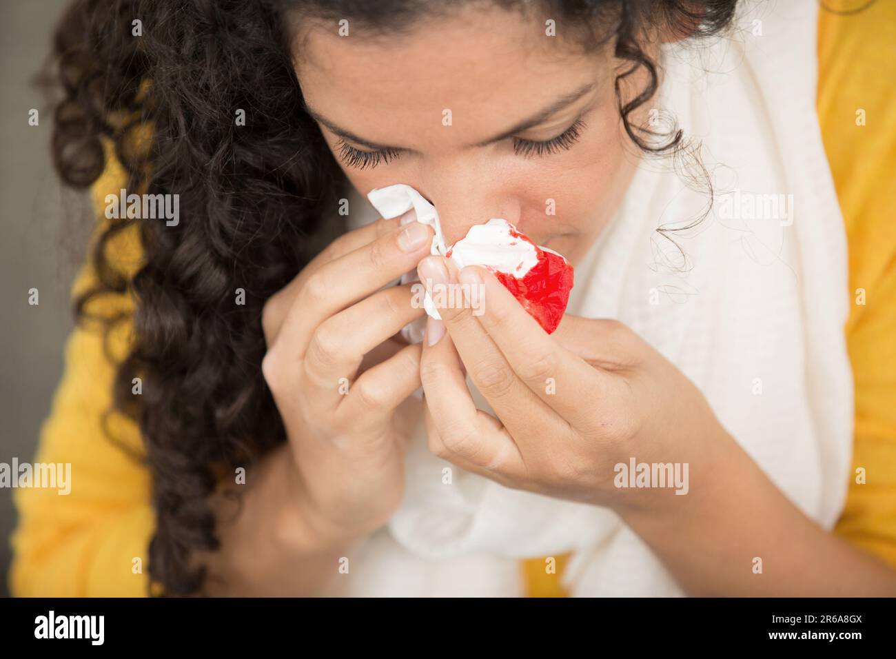 woman bleeding from her nose Stock Photo - Alamy