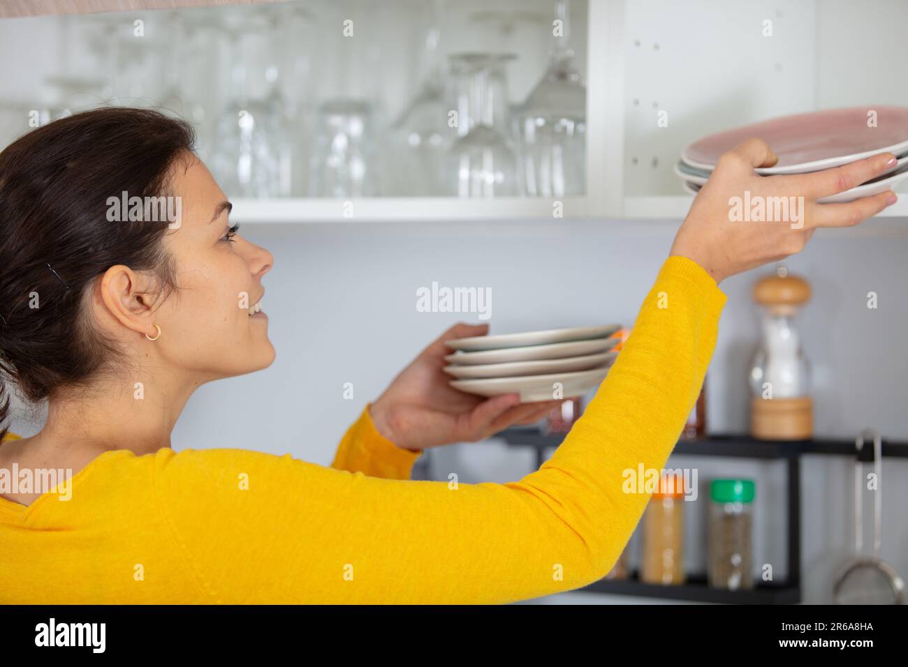 Young blonde woman washing clothes hi-res stock photography and images - Alamy