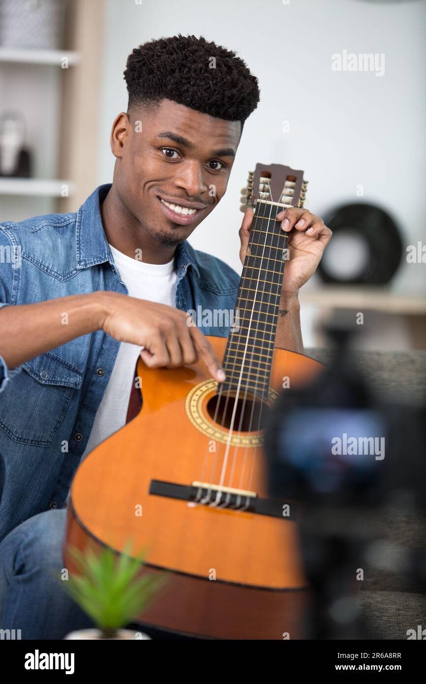 Male guitarist recording song home hi-res stock photography and images ...