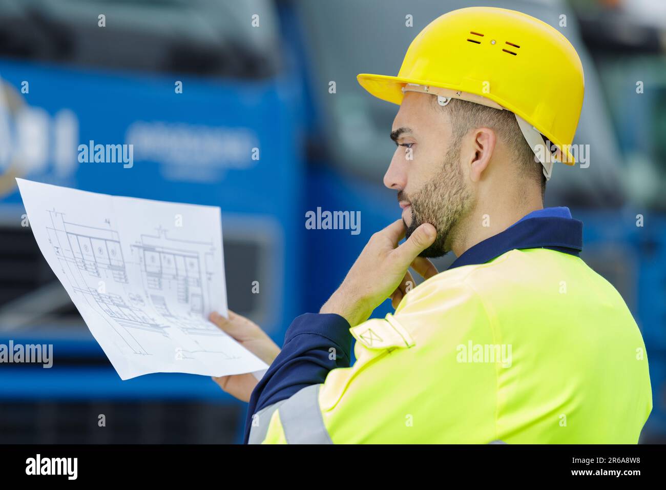 Male architect studying building plan hi-res stock photography and ...