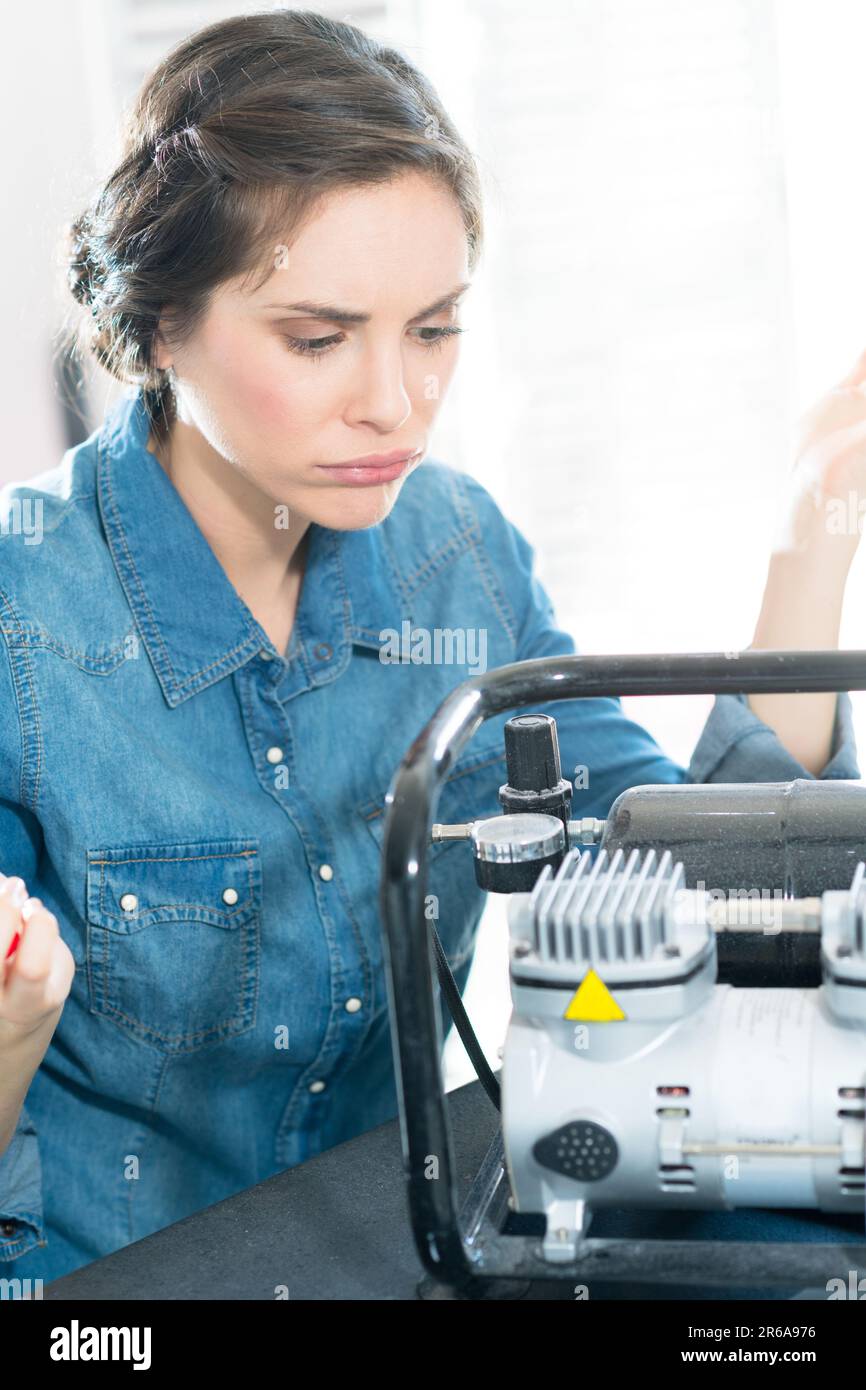 Woman auto mechanic inspecting hi-res stock photography and images - Alamy