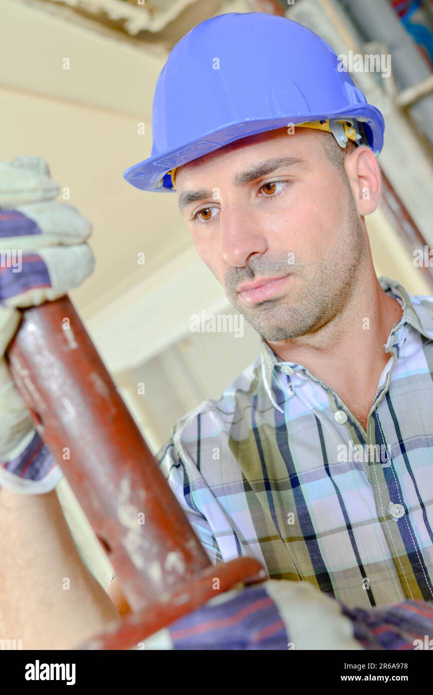 Construction worker placing a stay Stock Photo - Alamy