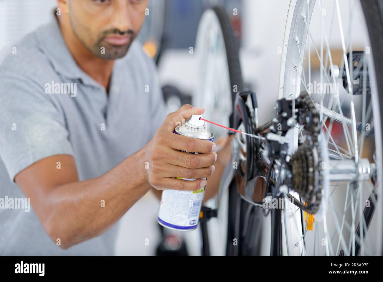 cleaning and oiling with oil spray Stock Photo - Alamy