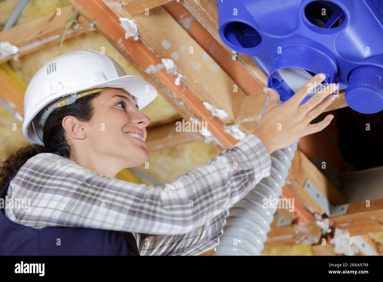 a female worker is assembling the ventilation box Stock Photo - Alamy