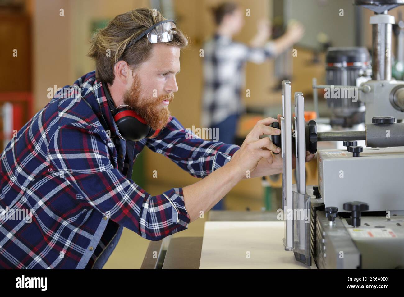 modern industrial machine operator working in factory Stock Photo - Alamy