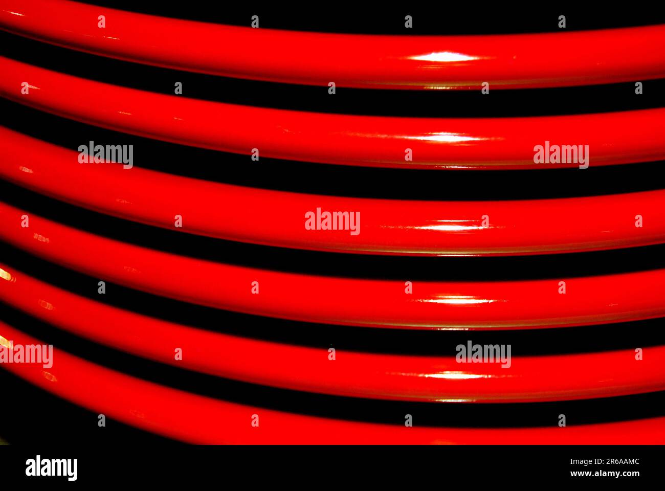 A closeup of red curvy striped wallpaper Stock Photo - Alamy
