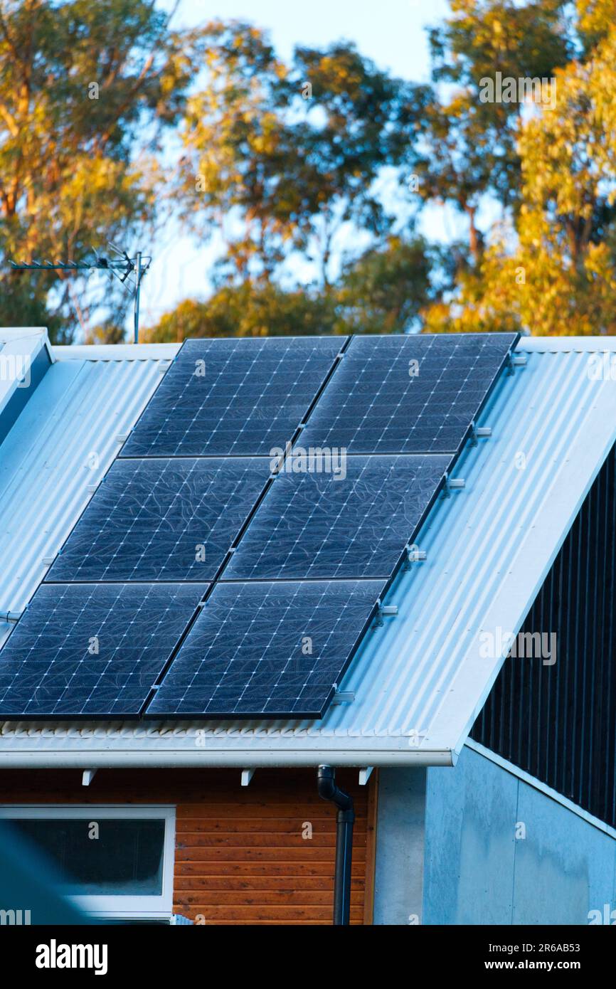 Photovoltaic PV solar panels on house roof in icy cold weather ...
