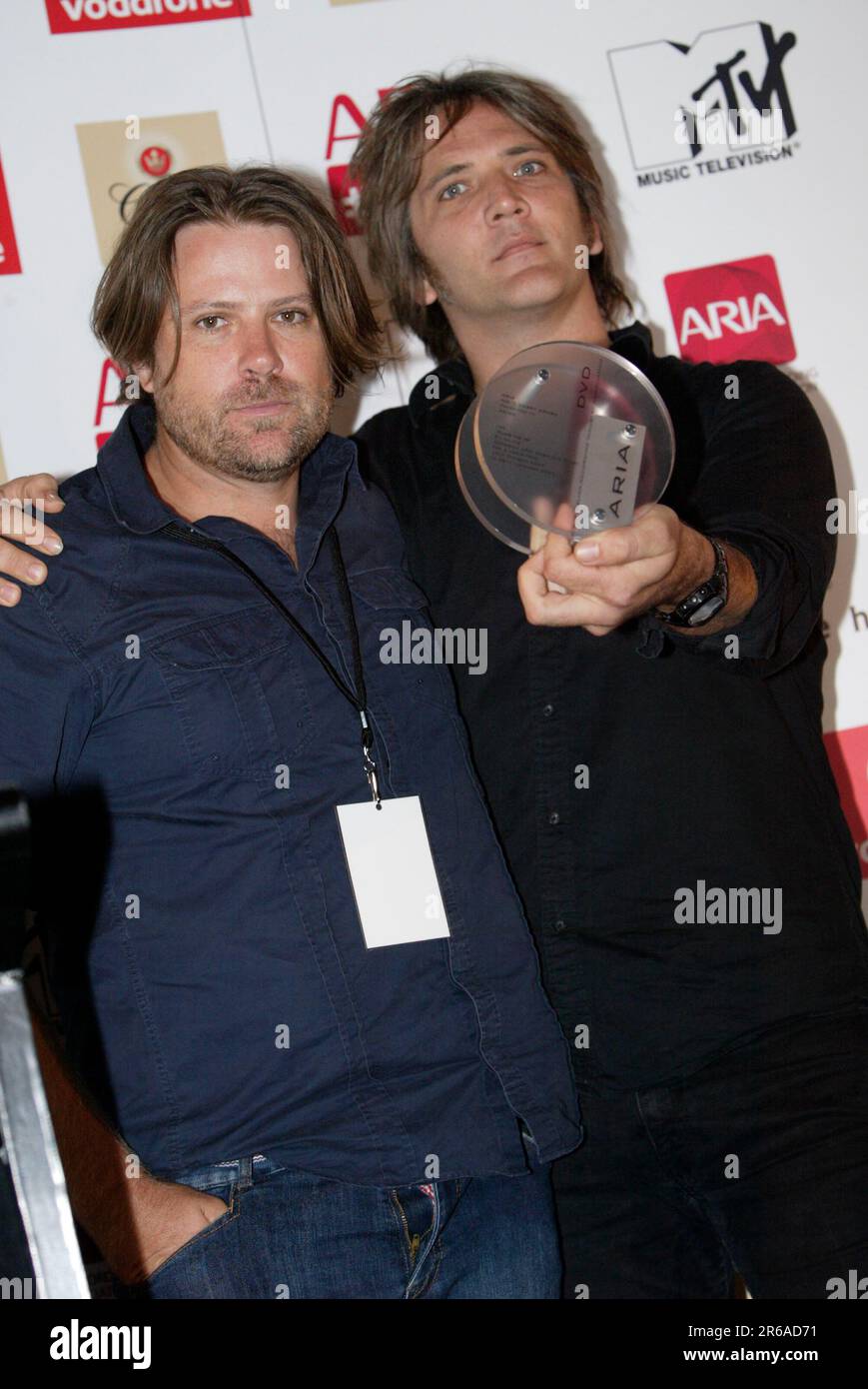 Powderfinger bass player John Collins (left) and lead guitarist Ian ...