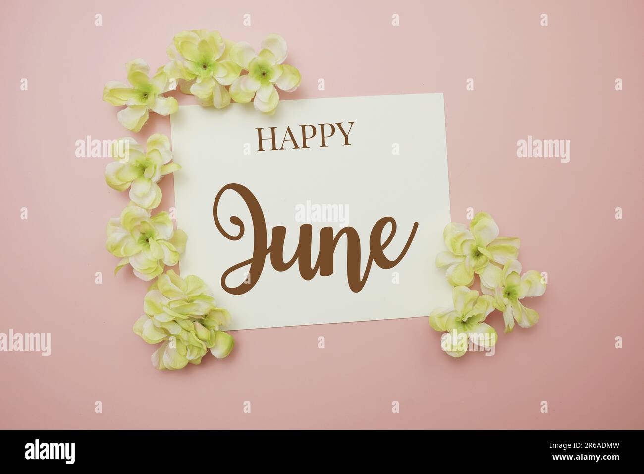 Happy June card typography text with flower bouquet on pink background ...
